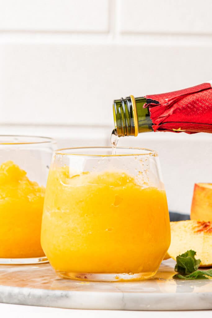 The Best Frozen Peach Bellini Cocktail Recipe - Kara Creates