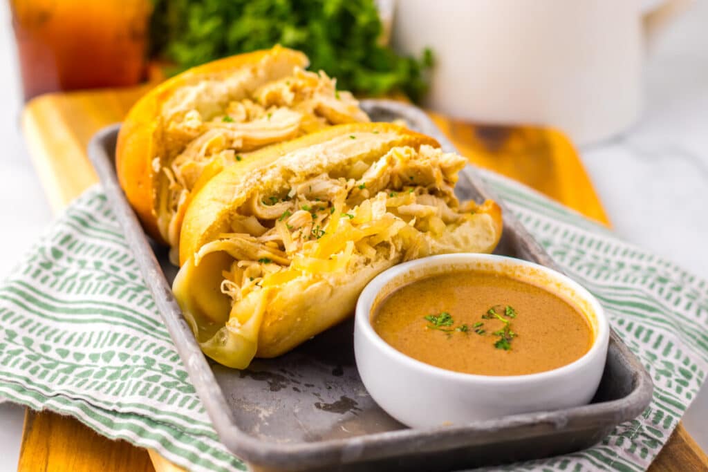 Easy Slow Cooker Chicken French Dip Sandwiches - Kara Creates