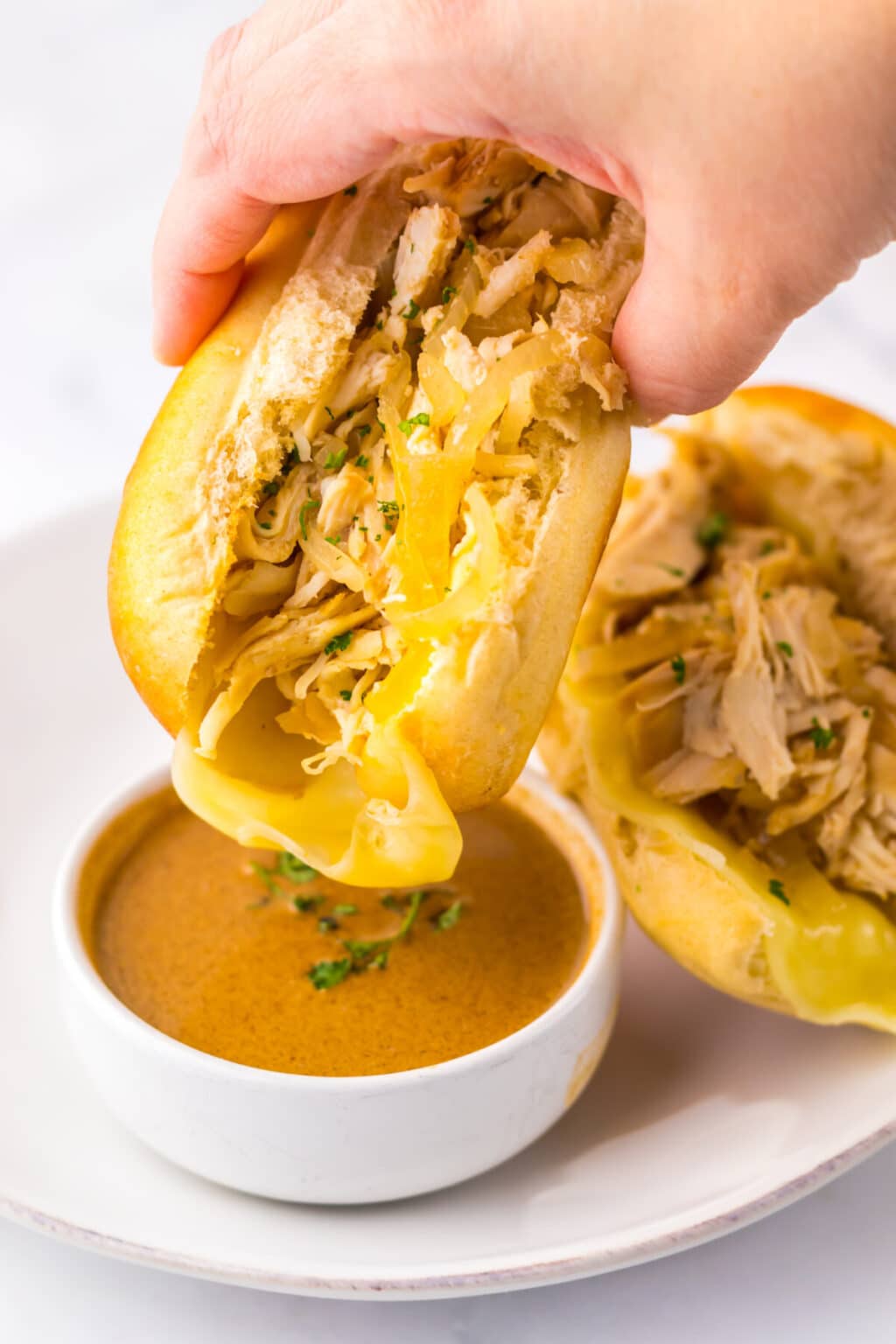 Easy Slow Cooker Chicken French Dip Sandwiches - Kara Creates